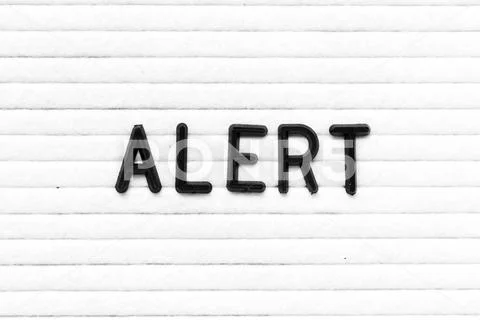 Black color letter in word alert on white felt board background Stock ...