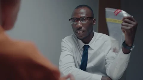 Black Detective Showing Evidence During ... | Stock Video | Pond5