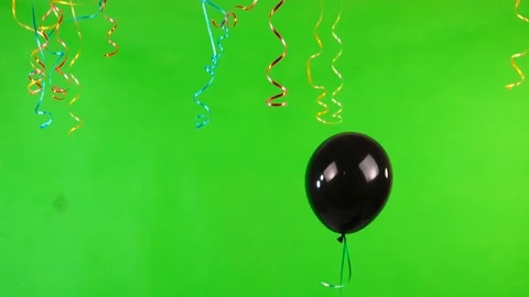 black flying balloon on green screen | Stock Video | Pond5