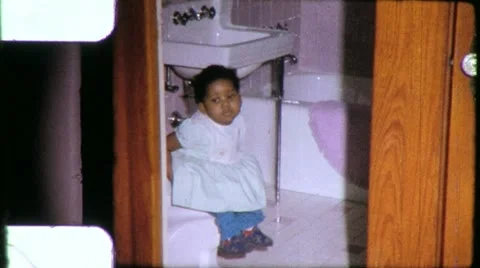 Black GIRL on TOILET Child African Ameri... | Stock Video | Pond5