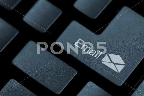 Black keyson a keyboard with the word email and an email icon on one of ...