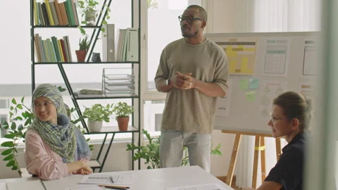 Black Male Teacher Giving Lesson to Immi... | Stock Video | Pond5