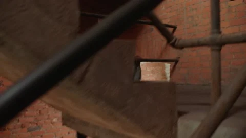 Black man chases a white man up an indus... | Stock Video | Pond5