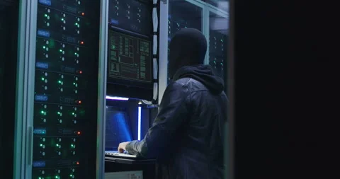 Black man hacking computer system in ser... | Stock Video | Pond5