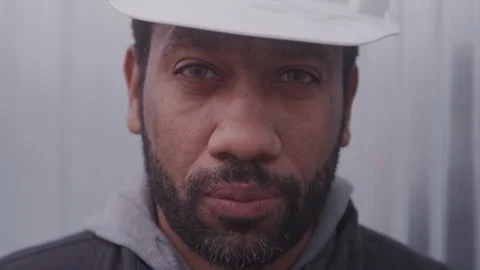 Black Man in a Hard Hat Standing Outside... | Stock Video | Pond5