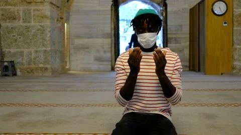Black Man Mask Mosque, African teen man ... | Stock Video | Pond5