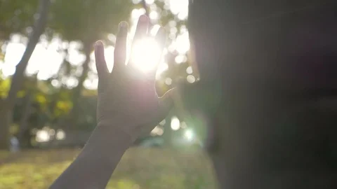 Black man protecting his face from sun w... | Stock Video | Pond5