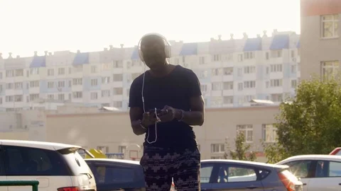 Black man running and listening to music... | Stock Video | Pond5