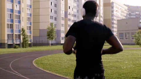 Black man running and listening to music... | Stock Video | Pond5