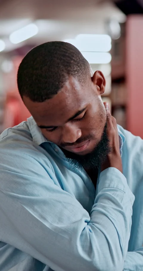 Black man, student and neck pain in libr... | Stock Video | Pond5