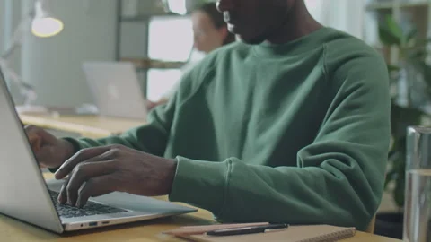Black Man Typing on Laptop at Office Des... | Stock Video | Pond5