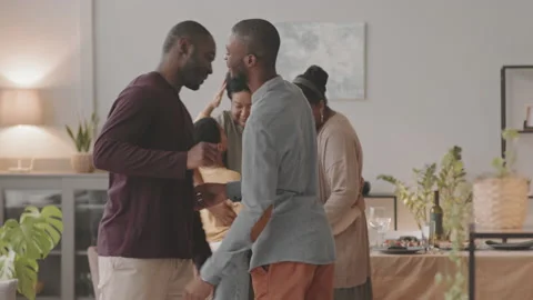 Black Men Hugging on Family Gathering | Stock Video | Pond5