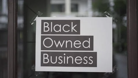 Black owned business sign attached on th... | Stock Video | Pond5