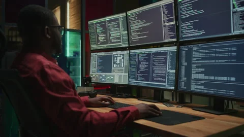 Black Programmer Using Multiple Displays... | Stock Video | Pond5