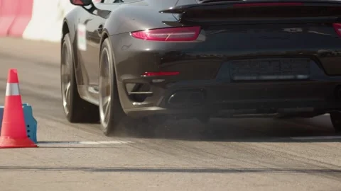 Black racing car with alloy wheels stand... | Stock Video | Pond5