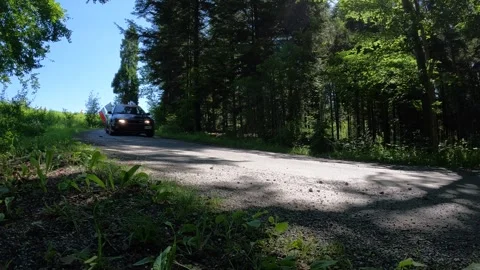 Black Racing Car Turning in Forest durin... | Stock Video | Pond5