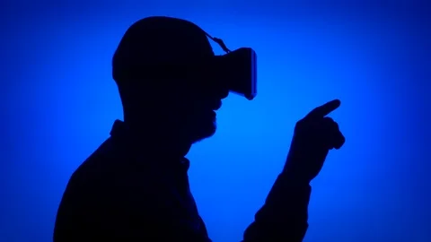 Black silhouette of senior man using VR ... | Stock Video | Pond5