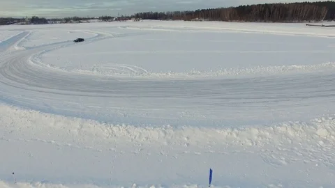 Black sport car passe turn of ice track ... | Stock Video | Pond5