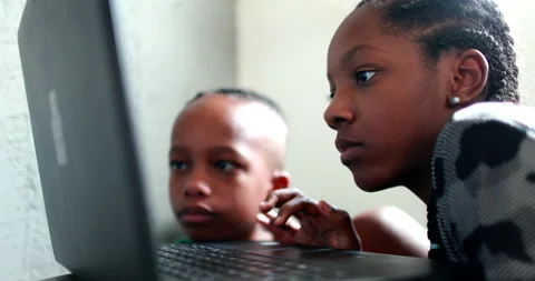 Black teen girl staring at computer scre... | Stock Video | Pond5