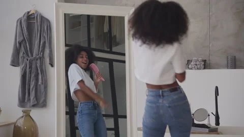Black Woman Singing in Hairbrush as Micr... | Stock Video | Pond5