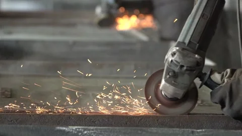 Blacksmith grinding metal plates with ci... | Stock Video | Pond5
