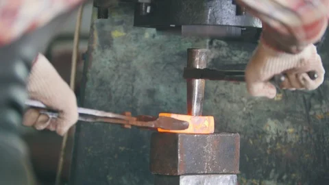 Blacksmith at work with electric hammer ... | Stock Video | Pond5