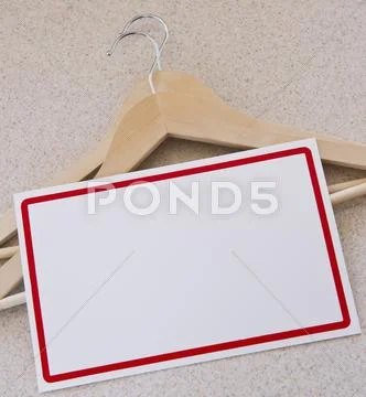 Blank price tag and coat hangers ~ Premium Photo #27882549