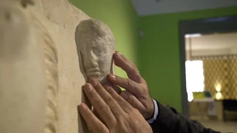Blind man touching the head of a statue ... | Stock Video | Pond5