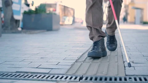 Blind person using white cane on straigh... | Stock Video | Pond5