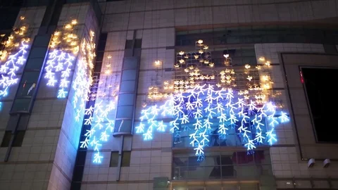 Blinking illuminated snowflakes on build... | Stock Video | Pond5