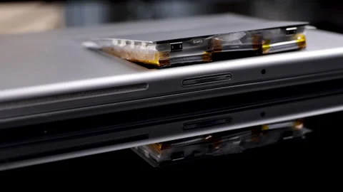Bloated lithium ion battery in laptop. F... | Stock Video | Pond5
