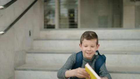 Blond child student reading book sitting... | Stock Video | Pond5