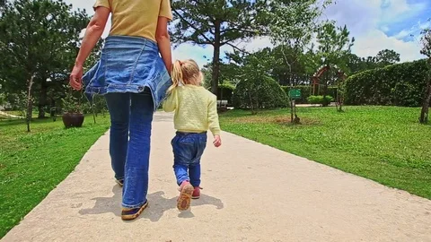 Blond Mother Little Girl Walk along Walk... | Stock Video | Pond5