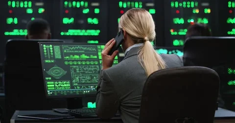 Blonde female programmer sitting at comp... | Stock Video | Pond5