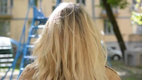 Blonde hair female head back view outdoo... | Stock Video | Pond5