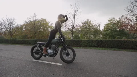 Blonde model in helmet and jacket poses ... | Stock Video | Pond5