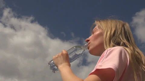 Blonde woman drink water plastic bottle ... | Stock Video | Pond5