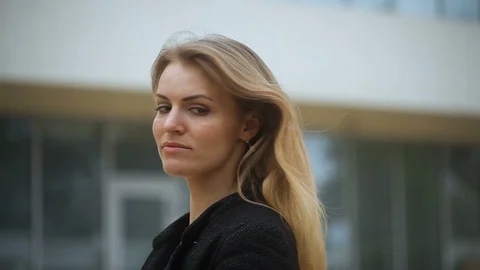 Blonde women waves her hair in the wind ... | Stock Video | Pond5