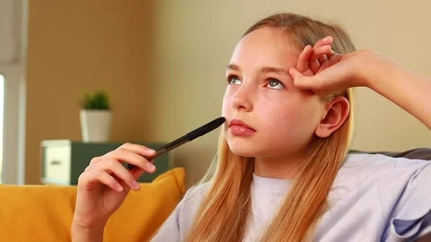 blonge hair little girl doing homework a... | Stock Video | Pond5