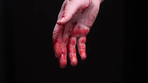 Bloody hand dripping blood on black back... | Stock Video | Pond5