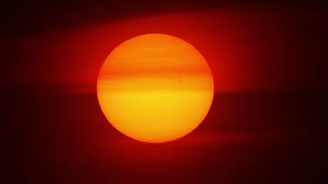 Bloody Sun covered by black clouds. Apoc... | Stock Video | Pond5