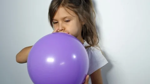 Kids Blowing Up A Balloon Stock Video Footage | Royalty Free Kids ...