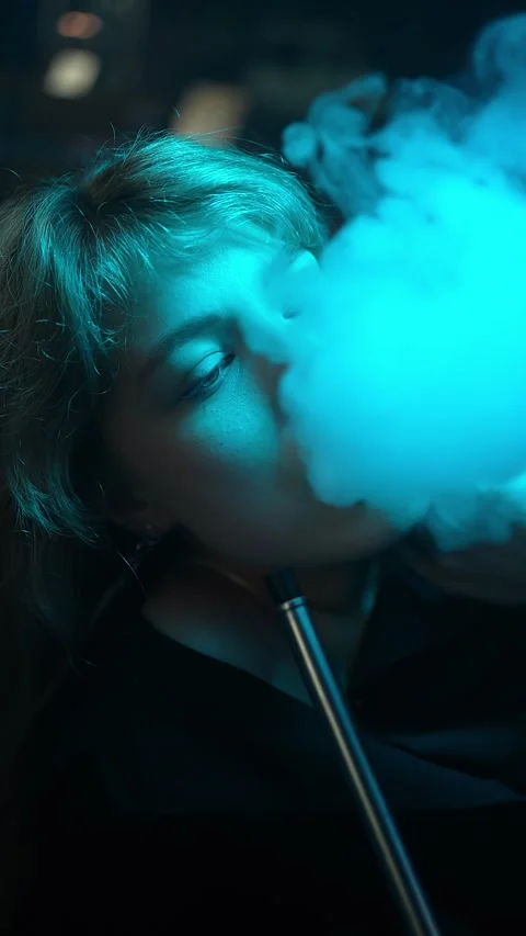 Blowing steam from a hookah through your... | Stock Video | Pond5
