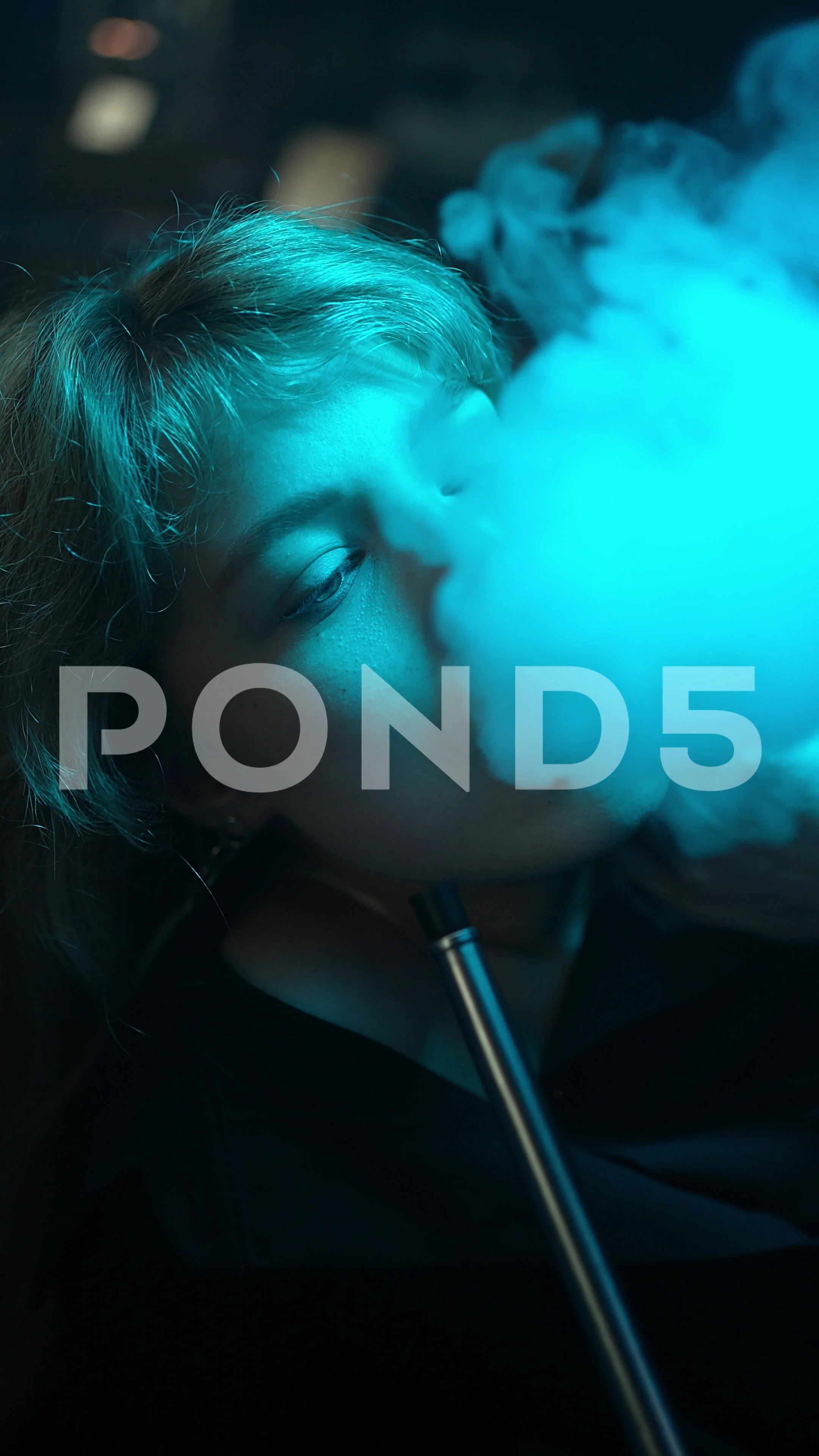 Girl Blowing Colorful Smoke