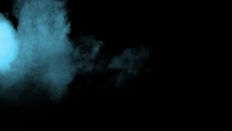 Blowing turquoise smoke in the middle of... | Stock Video | Pond5