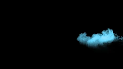 Blowing turquoise smoke in the middle of... | Stock Video | Pond5