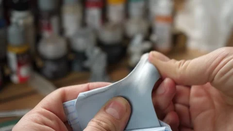 blu tack reusable adhesive putty, painti... | Stock Video | Pond5