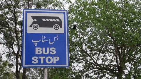 Blue Bus Stop Sign in Urdu and English L... | Stock Video | Pond5