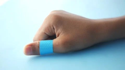 blue color adhesive bandage on hand | Stock Video | Pond5