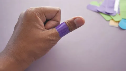 blue color adhesive bandage on hand | Stock Video | Pond5